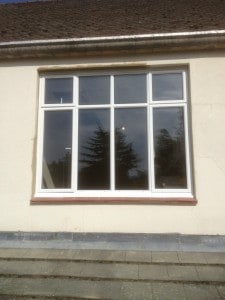 White powder-coated aluminium windows with clear toughened glass ...